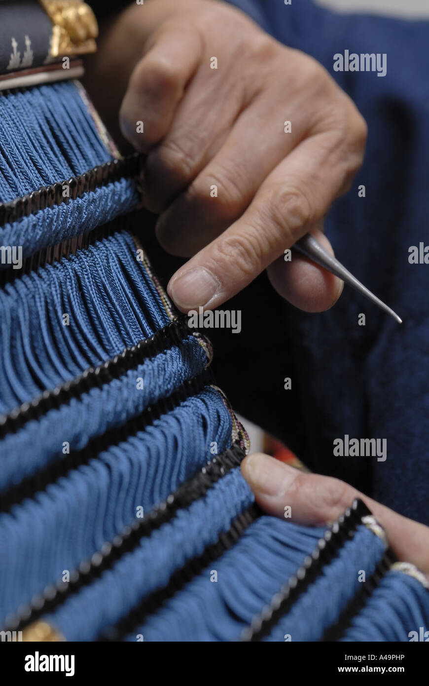 Close up of a person s hand making a traditional costume Stock Photo ...