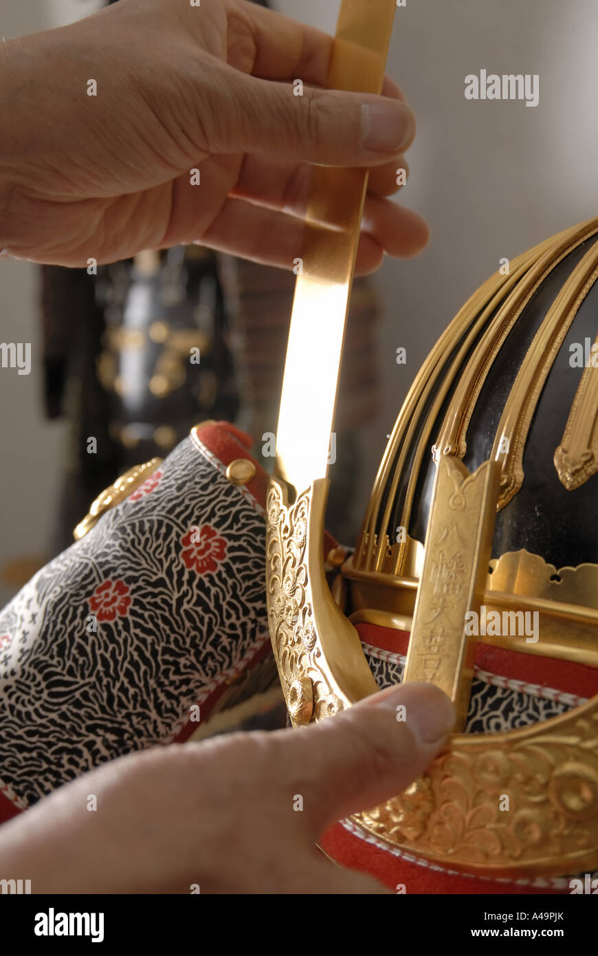 Close up of a person s hand making a suit of armor Stock Photo - Alamy