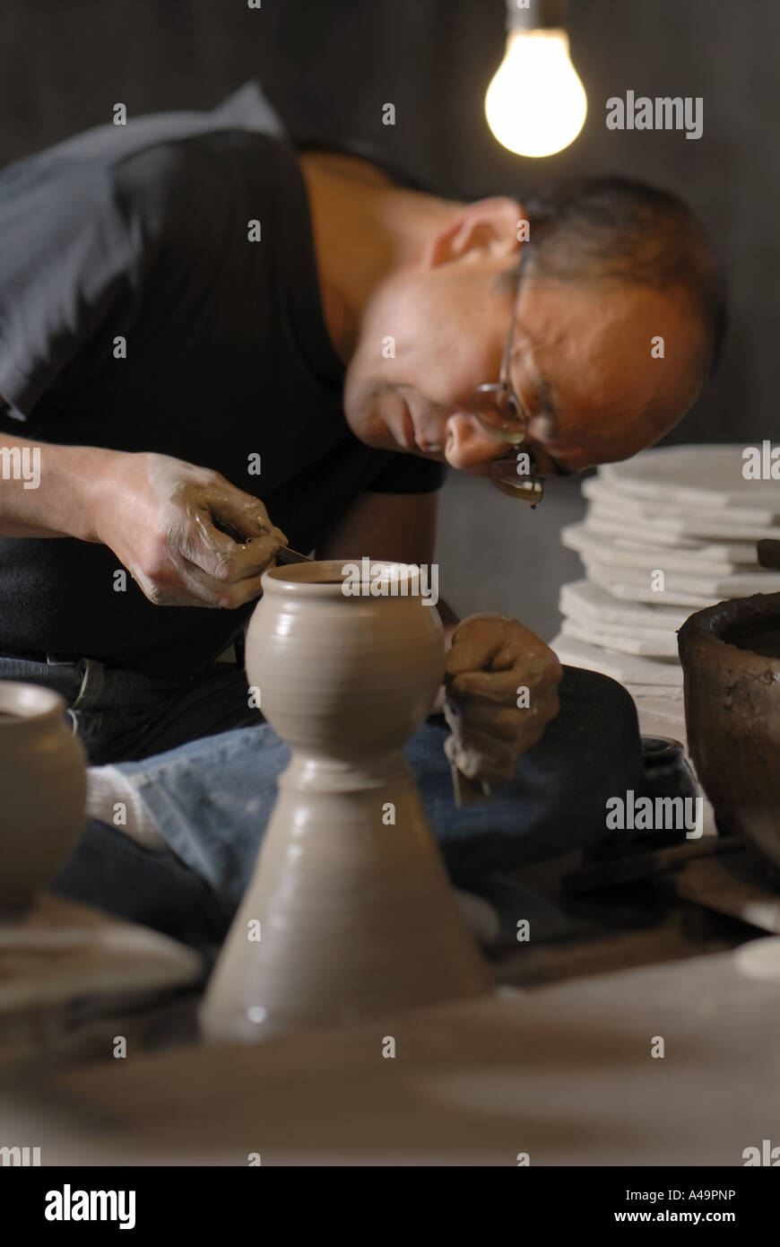 Close up of a potter making pottery Stock Photo - Alamy