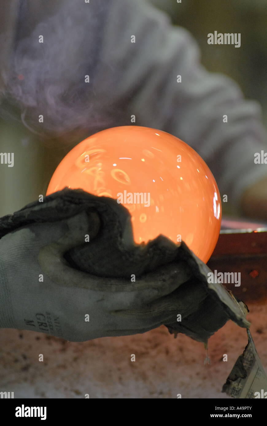 Close up of a person s hands molding a glass bulb Stock Photo - Alamy