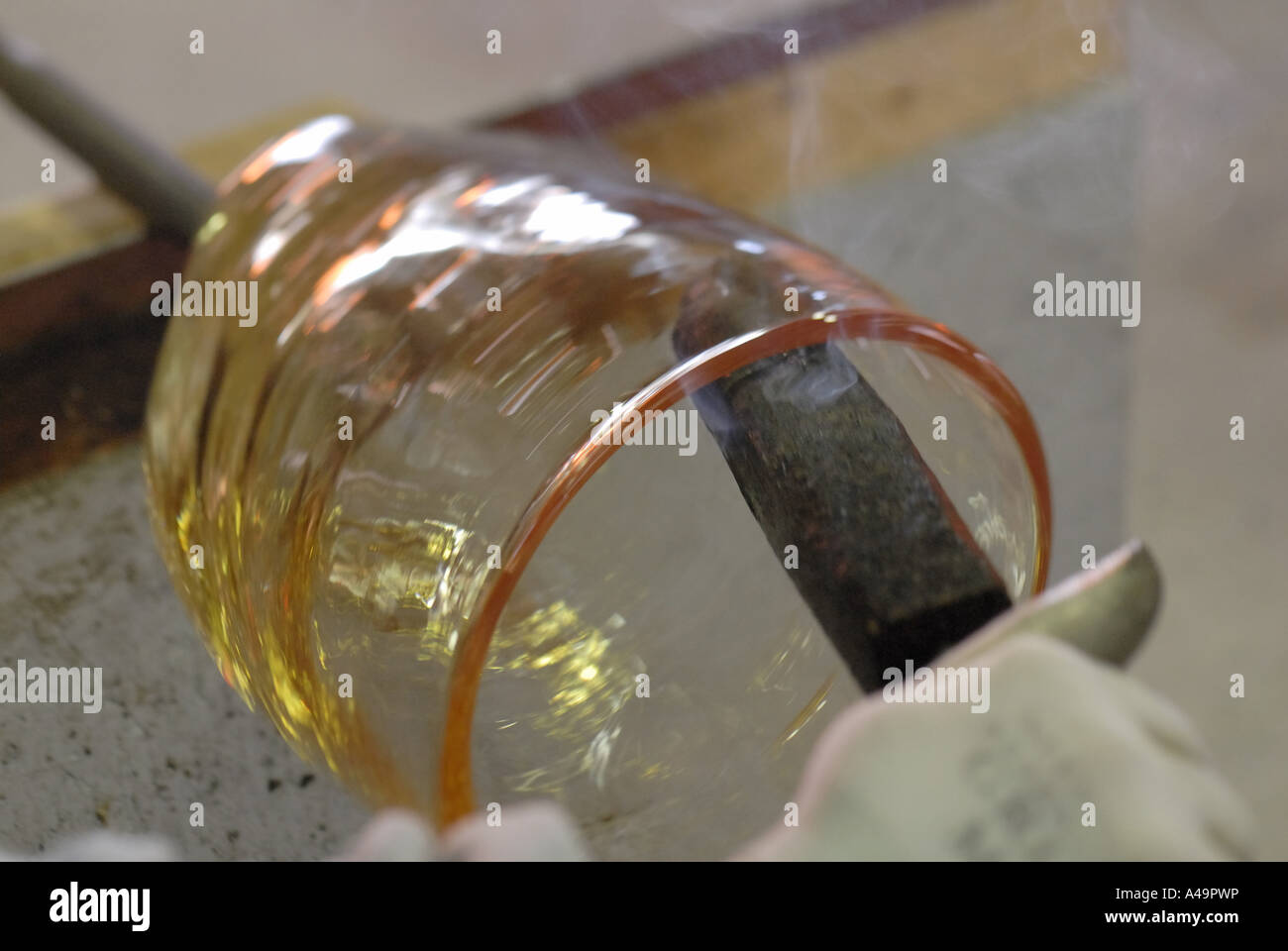 Close up of a person s hand molding a glass bulb Stock Photo - Alamy
