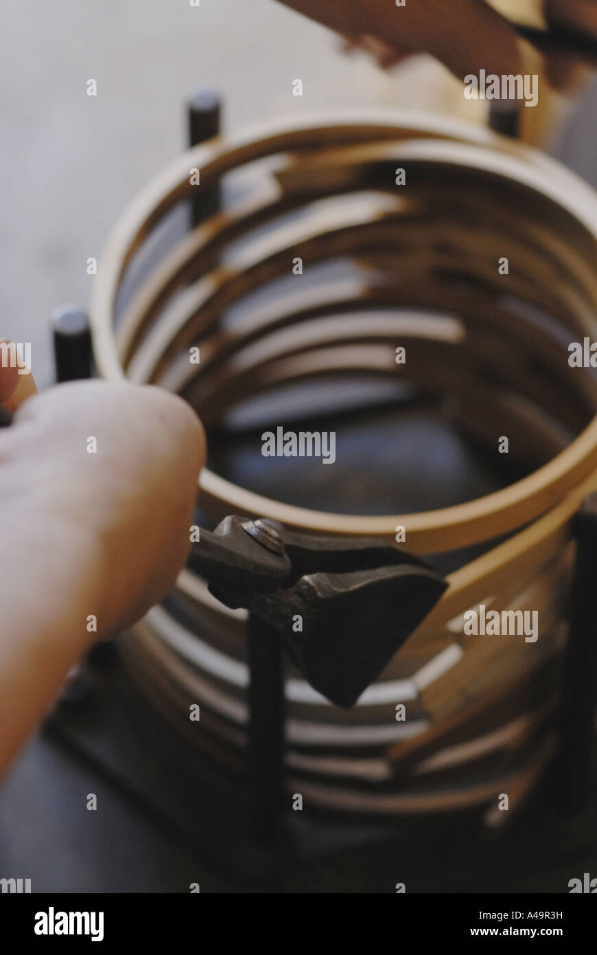 Close up of a human hand making a wooden basket Stock Photo - Alamy