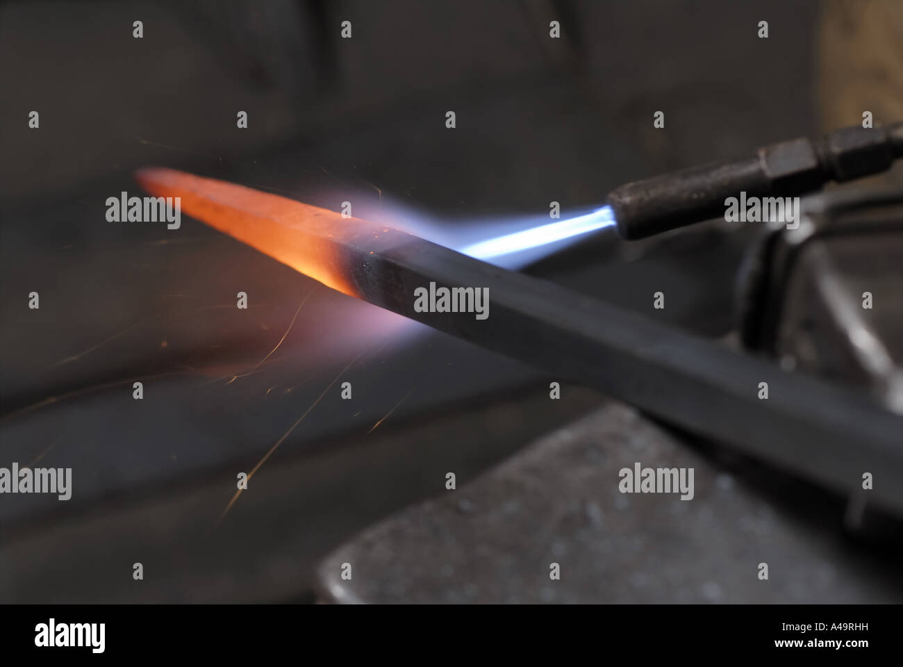 Welding torch heating an iron rod Stock Photo - Alamy