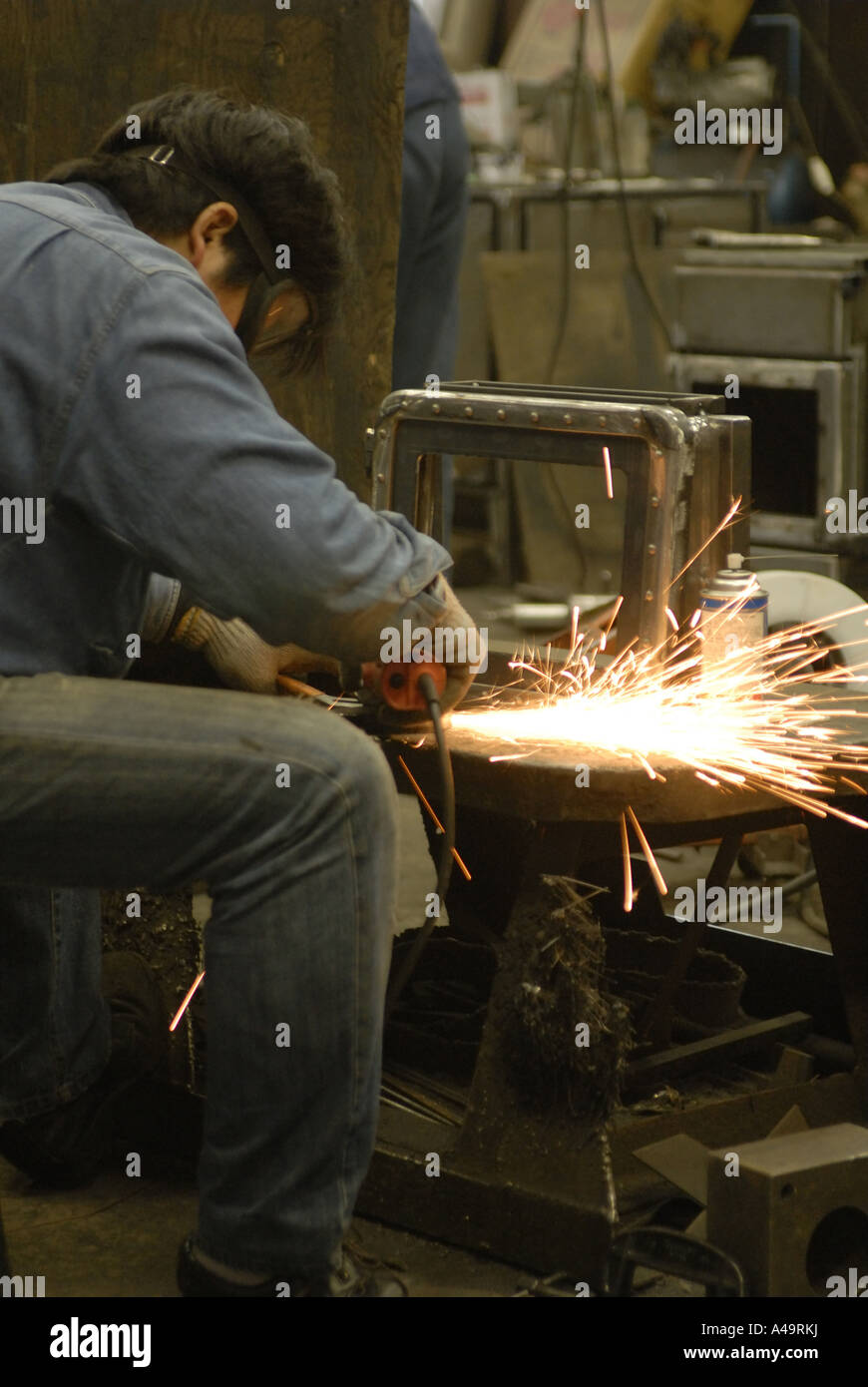 Side profile of a welder welding in a workshop Stock Photo - Alamy