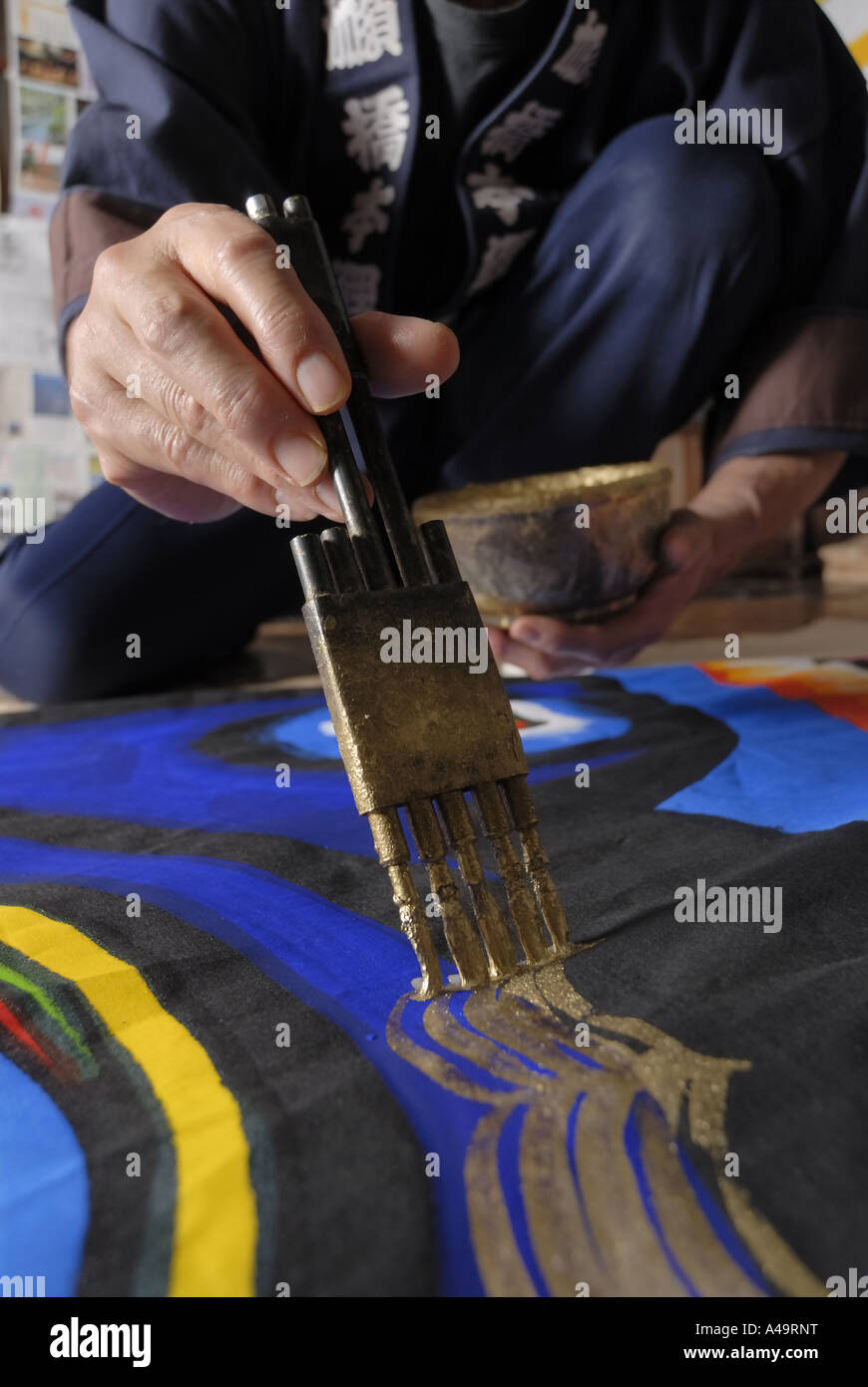 Close up of a painter s hands painting on a sheet Stock Photo - Alamy