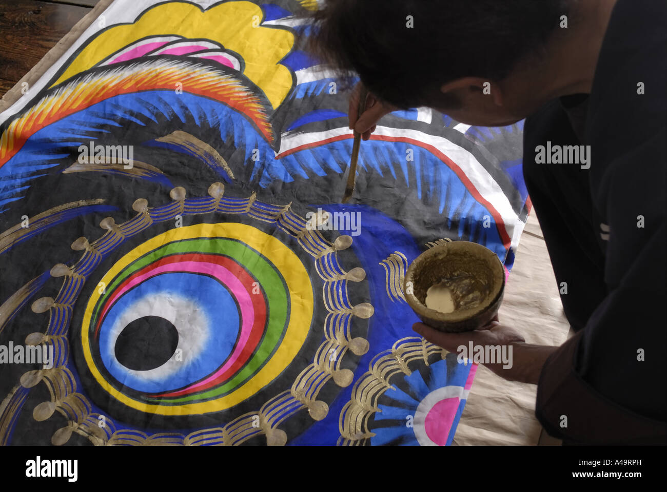 Side profile of a painter painting Stock Photo - Alamy
