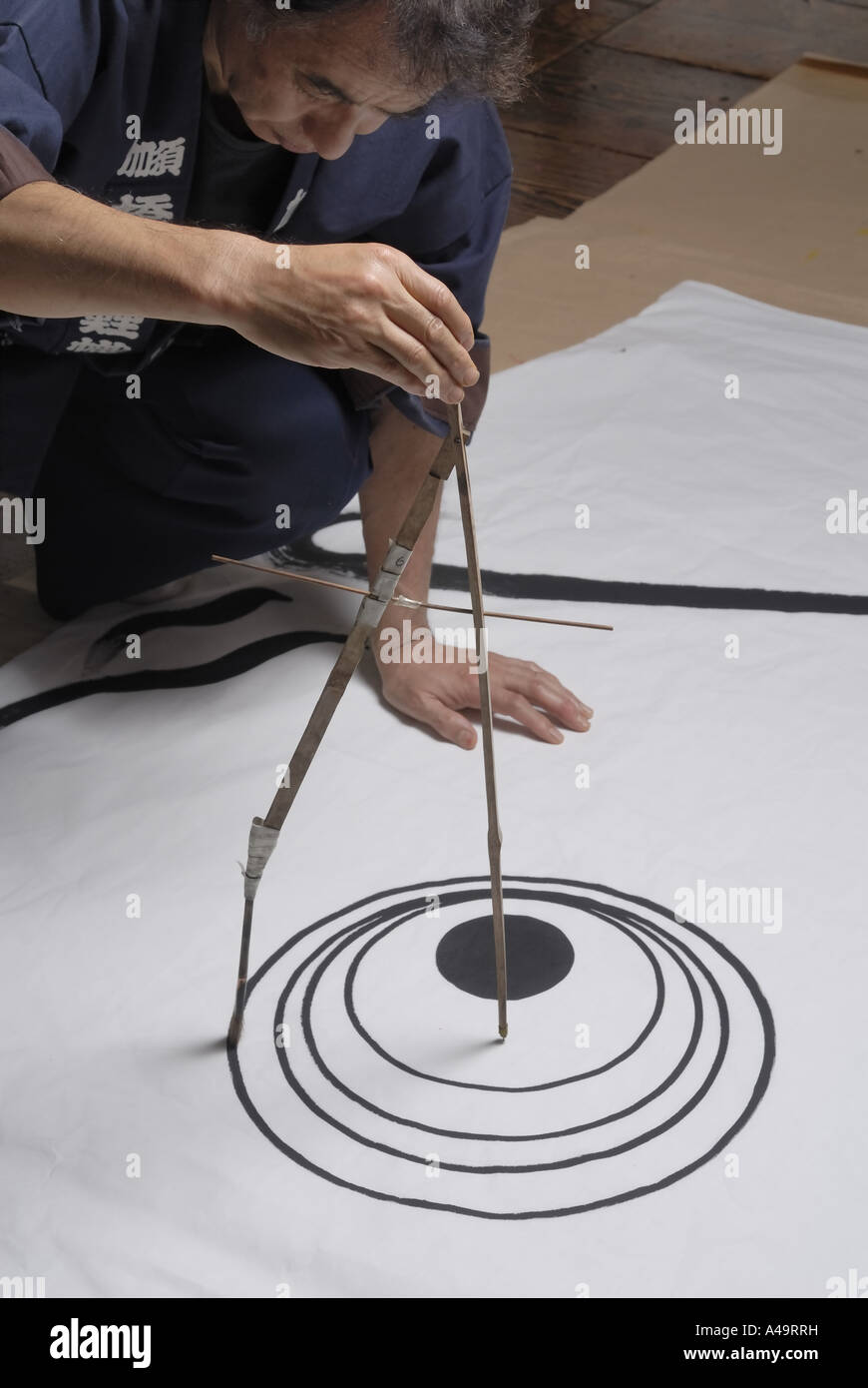 Painter painting on a sheet Stock Photo - Alamy