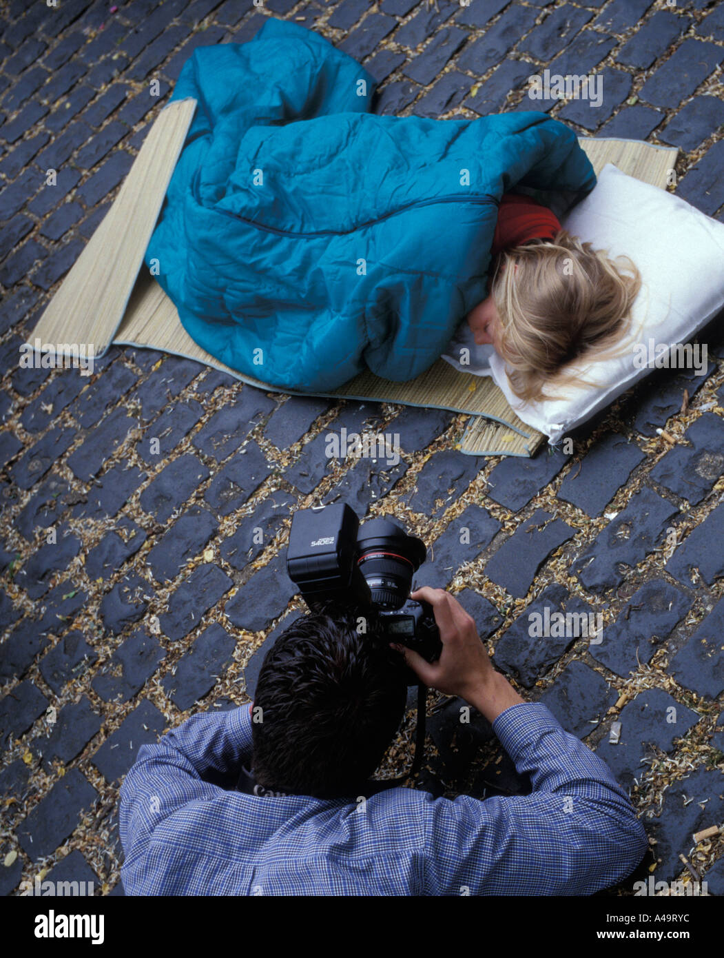 Photographer snapping young sleeping blond girl spectator at Royal ...