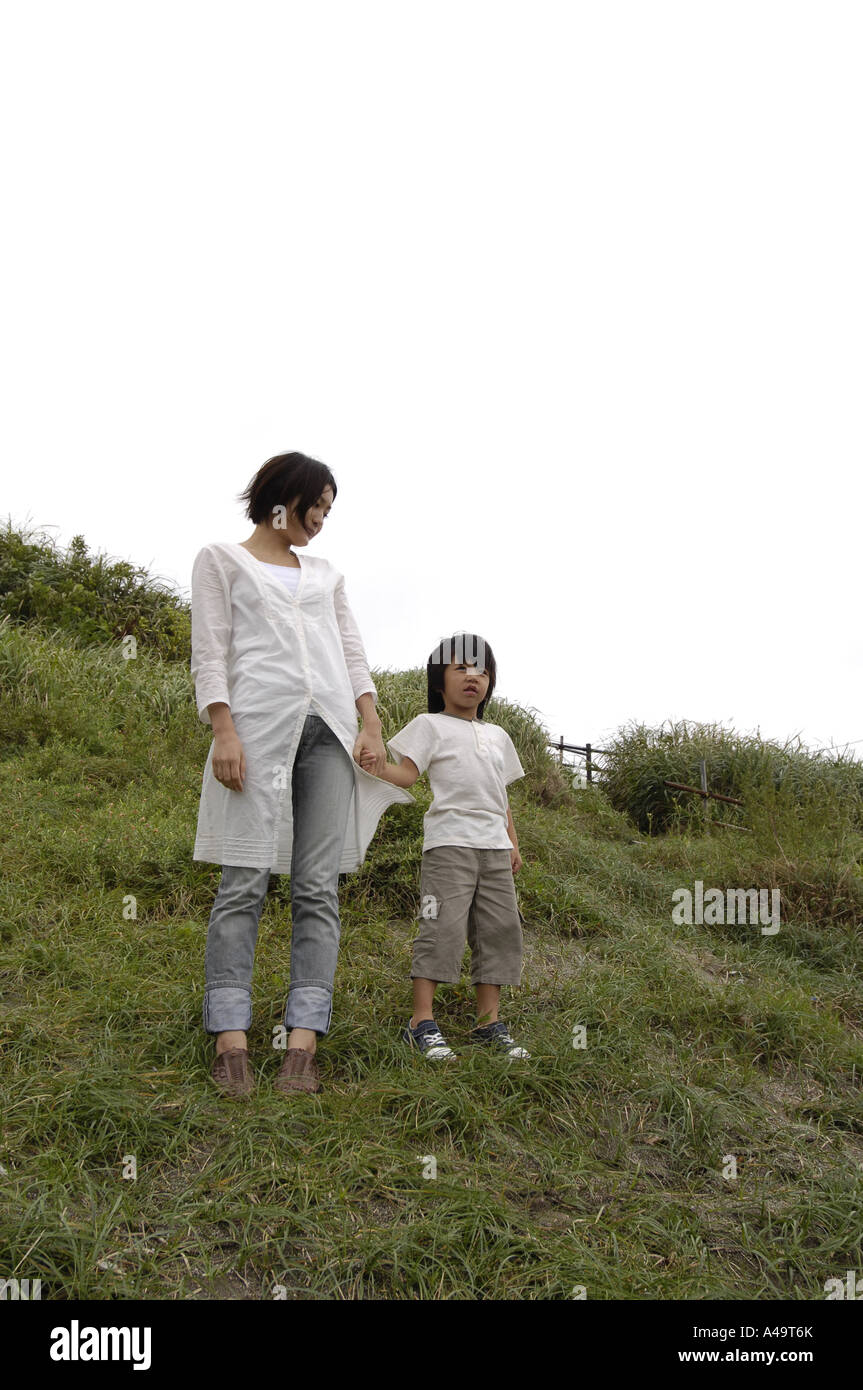 Low angle view of a mid adult woman and her son standing Stock Photo ...