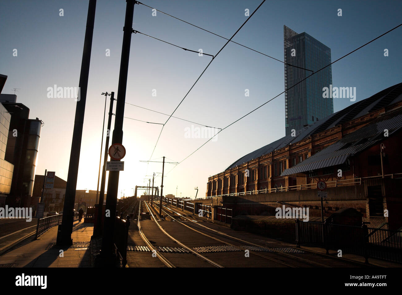 Metrolink tram lines, Lower Mosley Street, with the Hilton Hotel ...