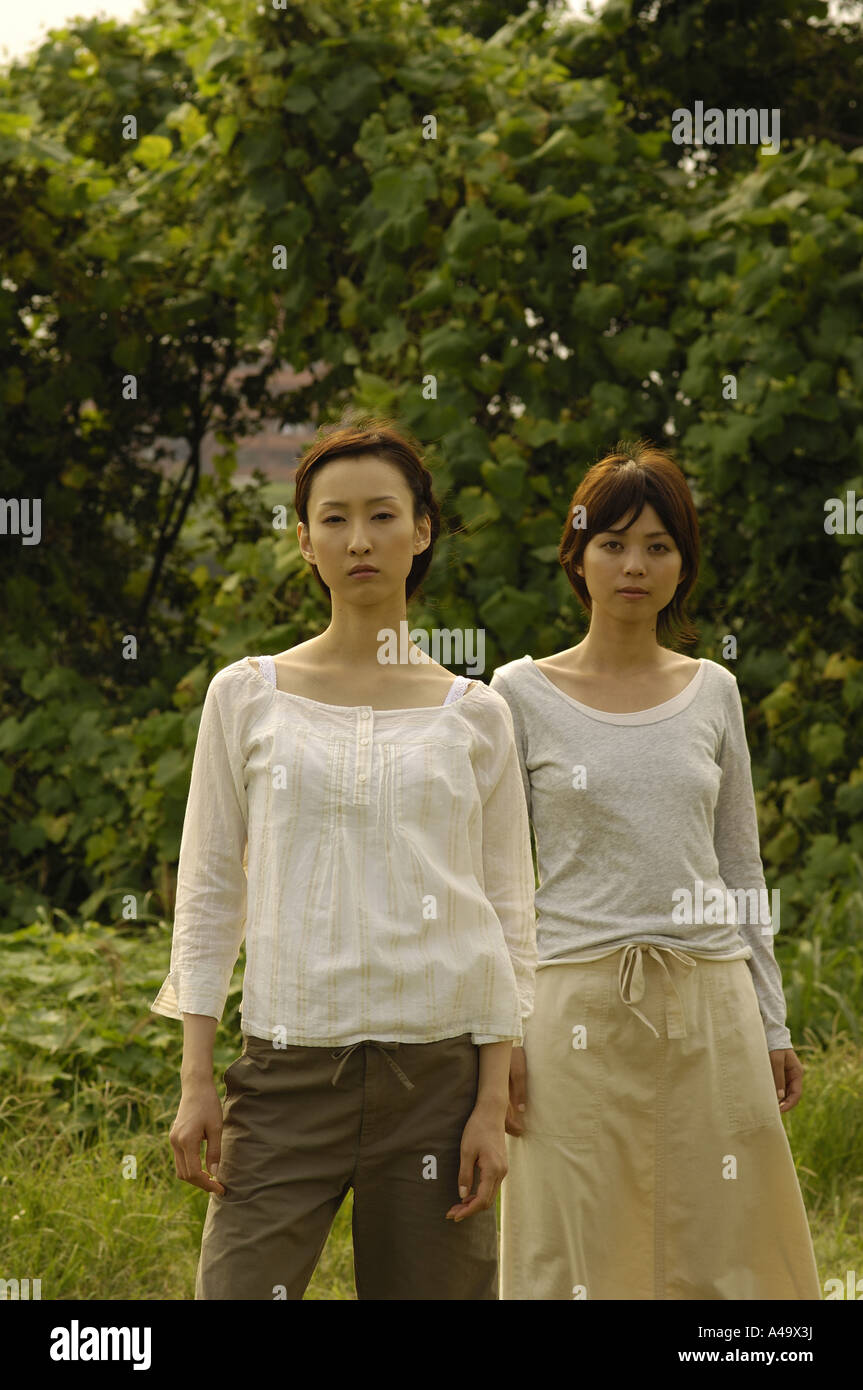 Portrait of two young women standing together Stock Photo - Alamy