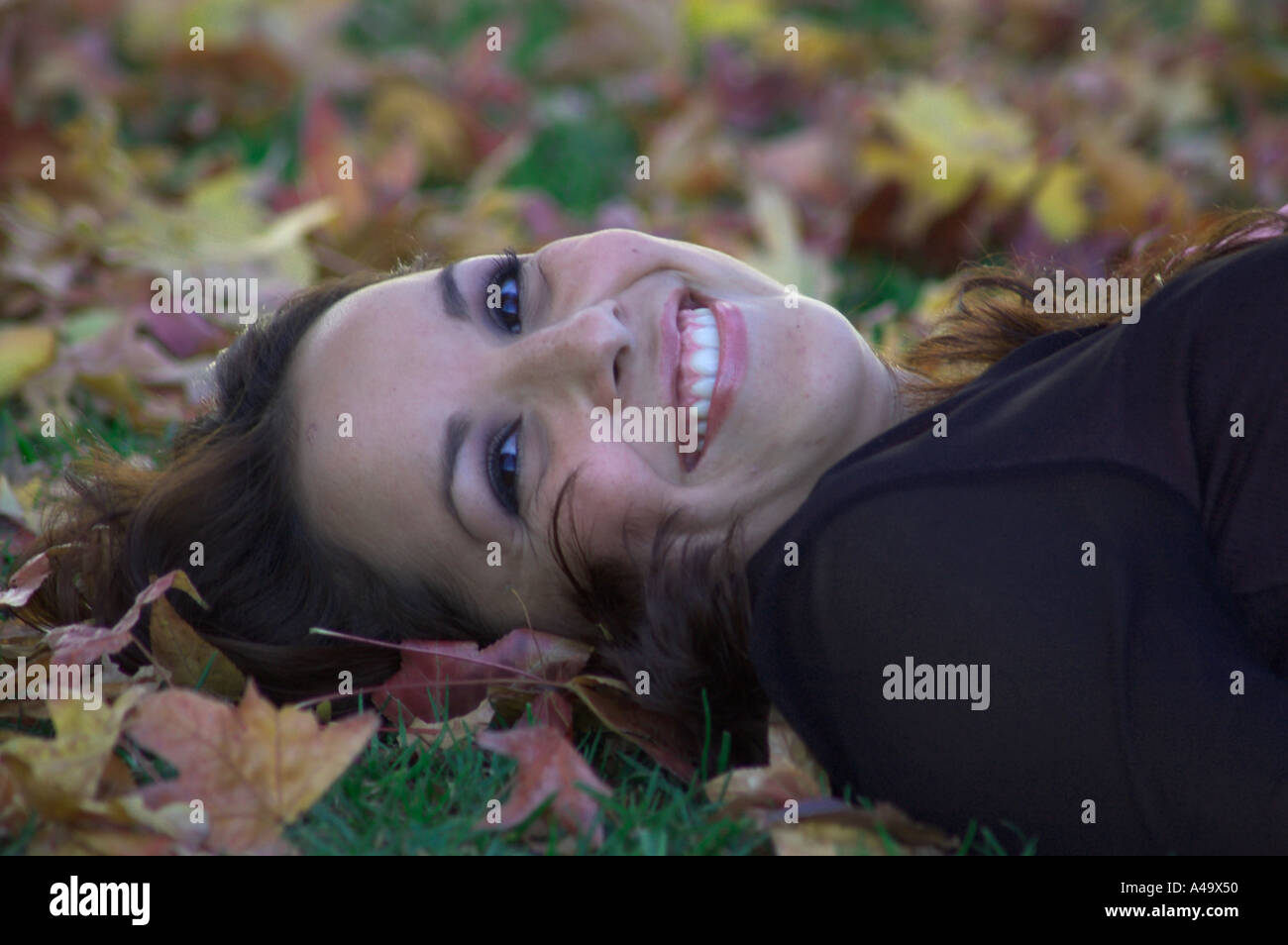 Latin lady lying down Stock Photo - Alamy