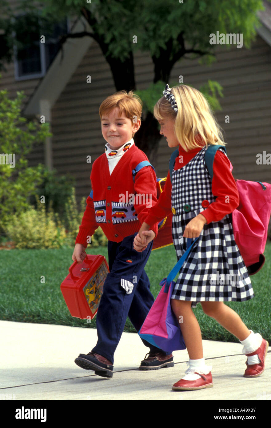 Two boys walking together school hi-res stock photography and images ...
