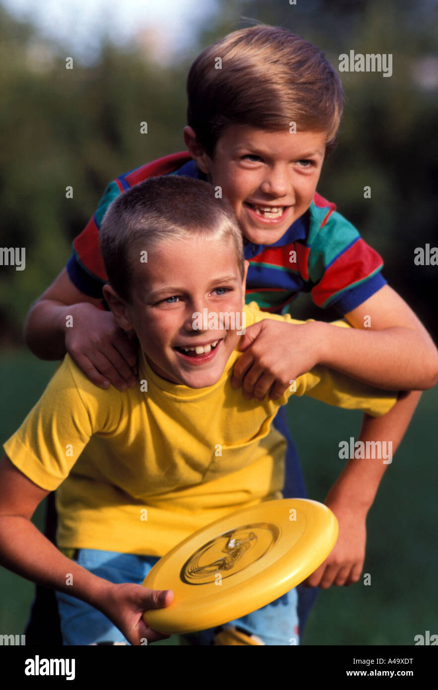 two boys playing frisbee, USA Stock Photo - Alamy
