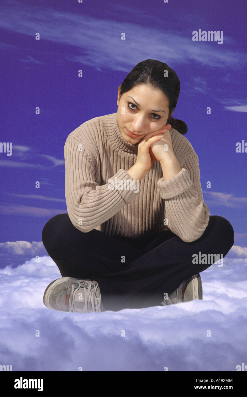 young woman sitting on a cloud Stock Photo - Alamy
