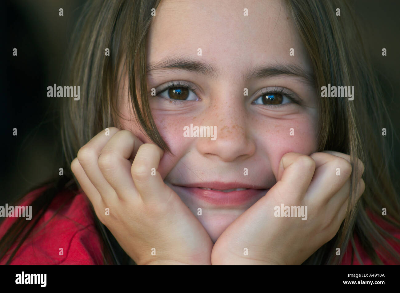 girl with hands on face Stock Photo - Alamy