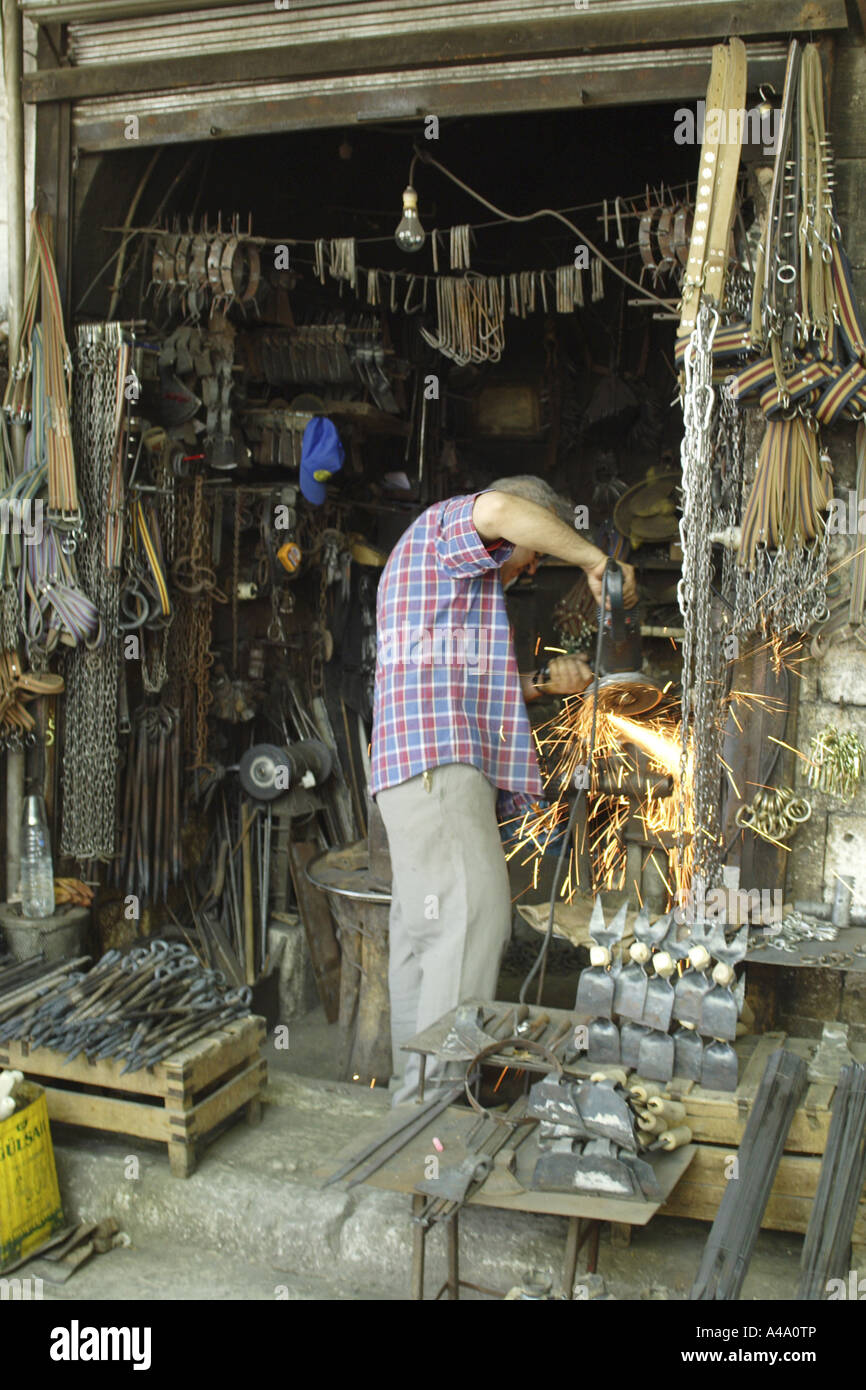 Forger working with metal on a turkish bazar hi-res stock photography ...