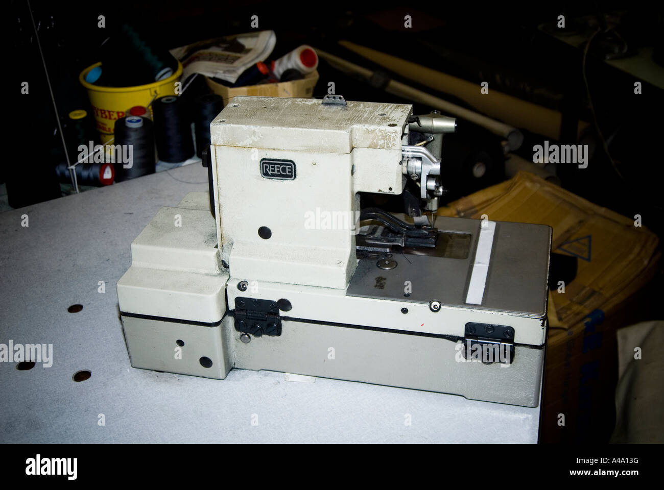 Eyelet buttonhole machine Stock Photo - Alamy