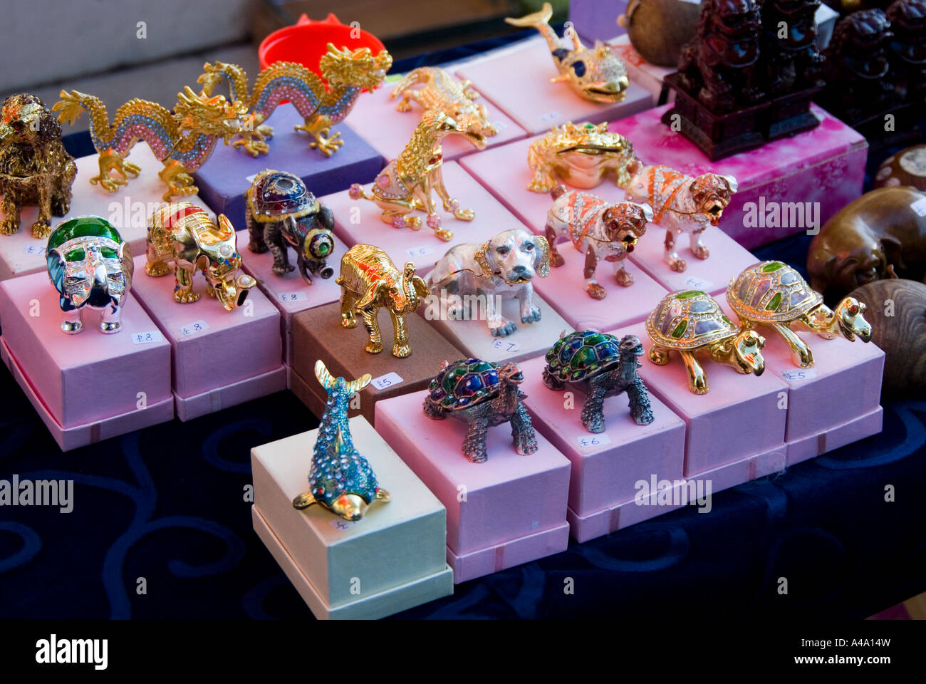 Small Chinese souvenirs statues Stock Photo - Alamy