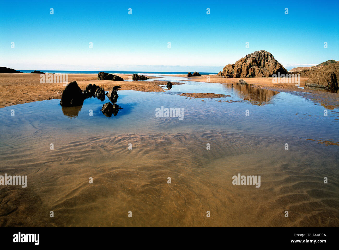ROCKS SAND AND WATER COMBESGATE BEACH BARRICANE BEACH WOOLACOMBE DEVON ...