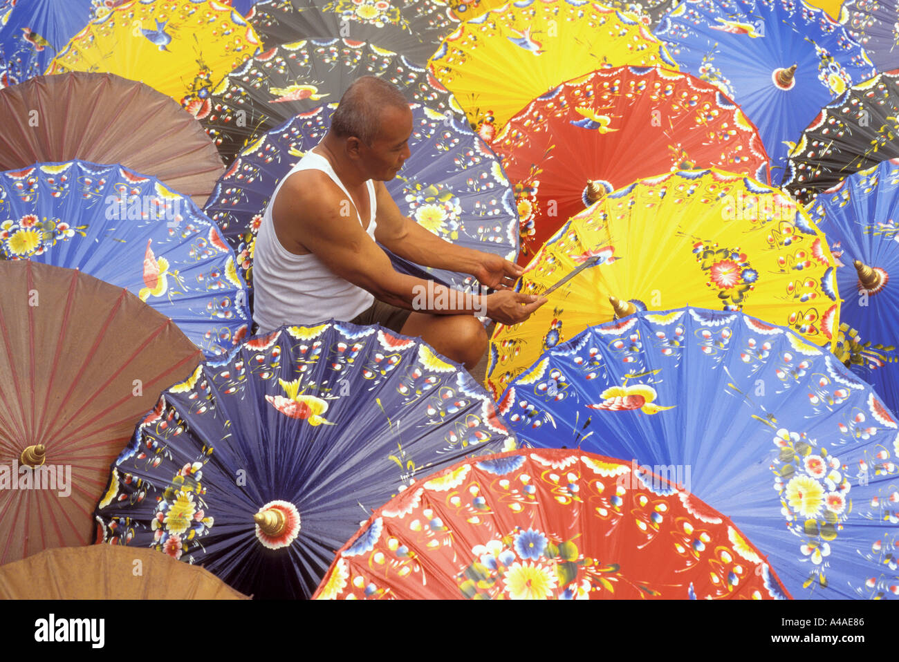 Man and painting and umbrella hi-res stock photography and images - Alamy