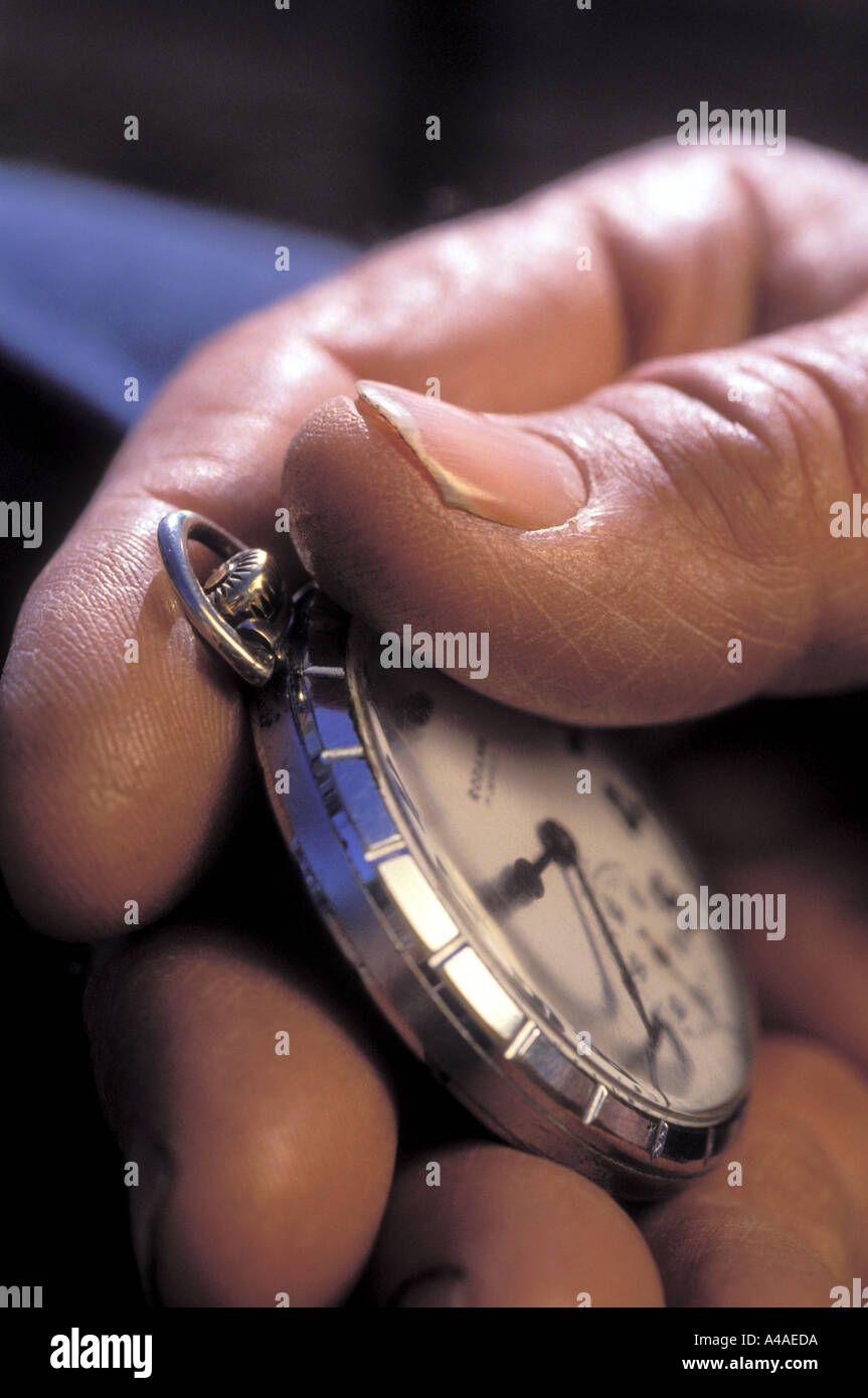 Weathered mans hand holding a pocket watch Stock Photo - Alamy