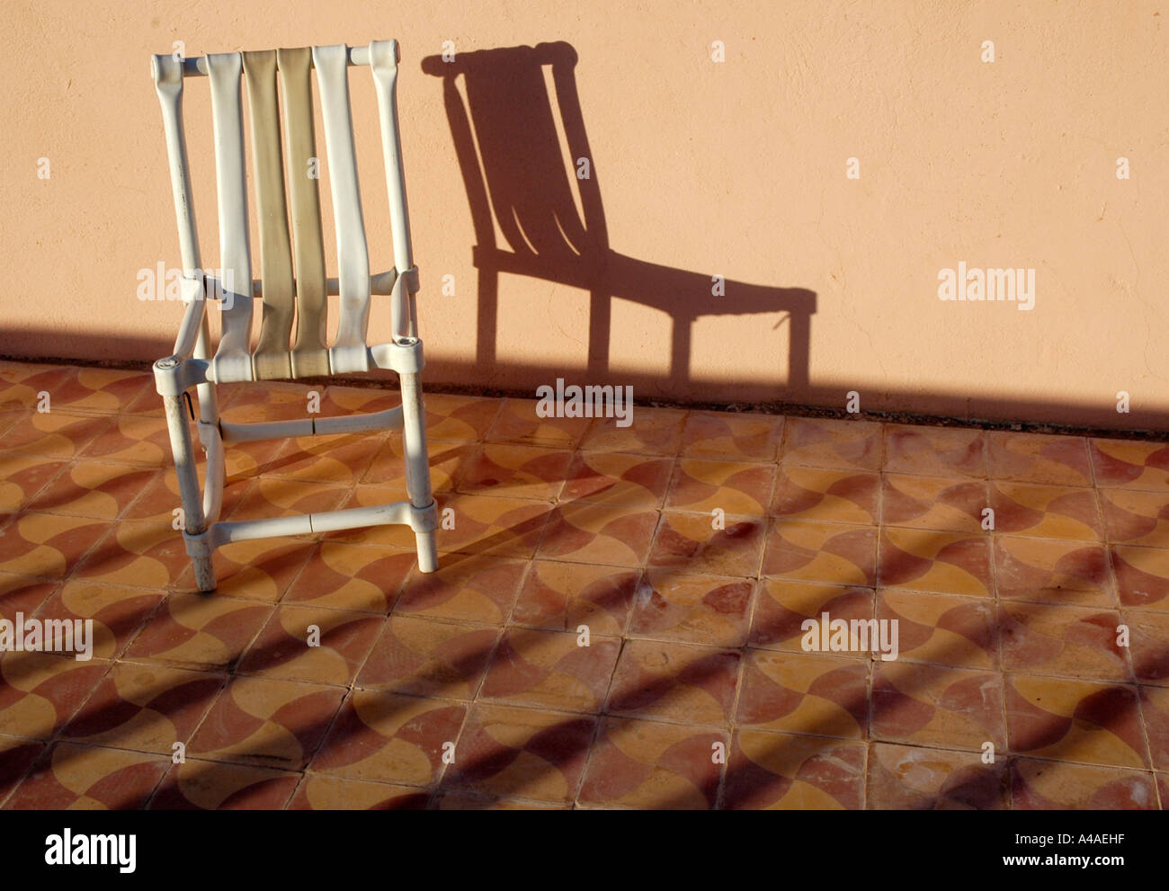 Chair and shadow Stock Photo - Alamy