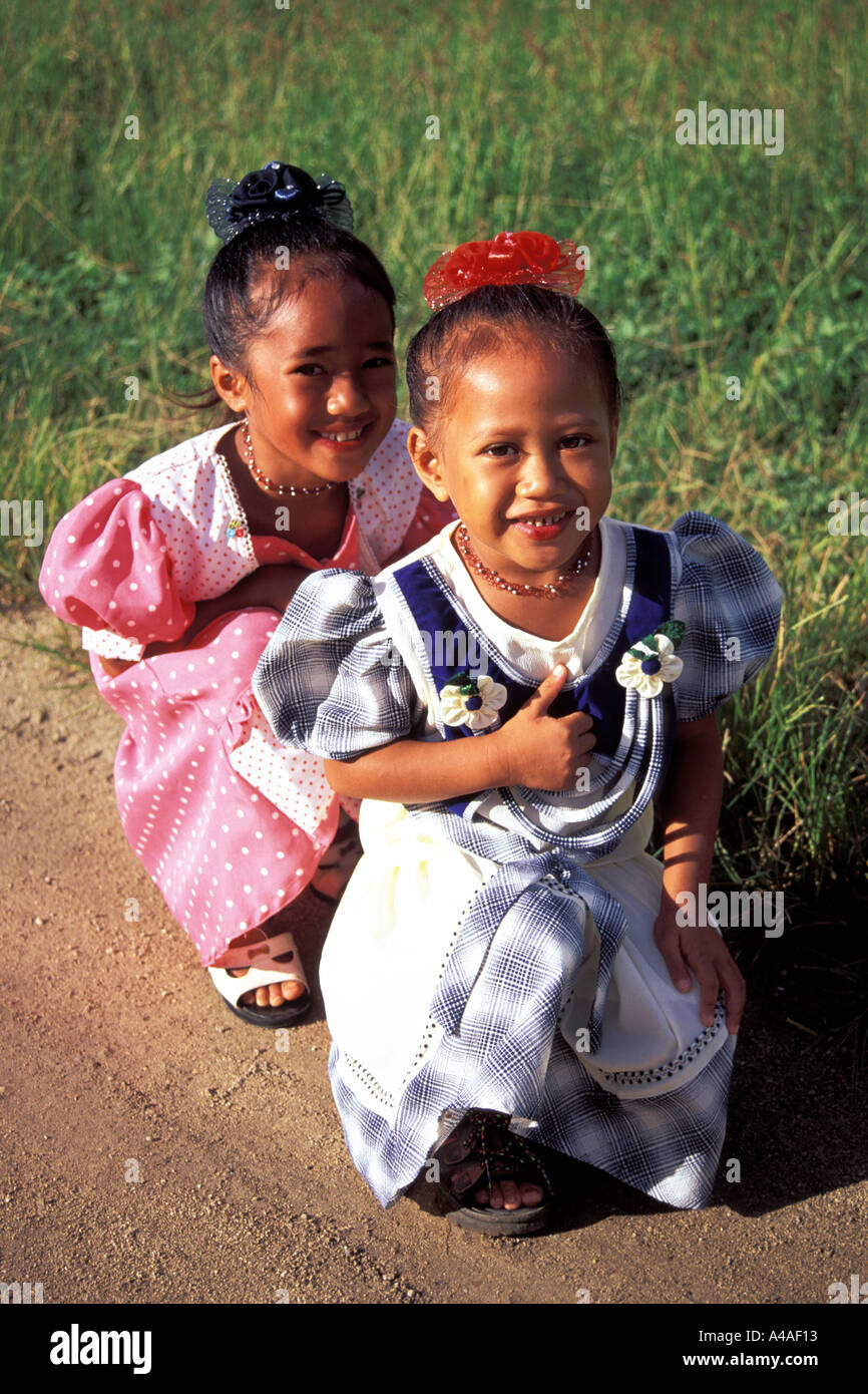 Cook Islands Atiu Girls in Sunday best going to church Stock Photo - Alamy