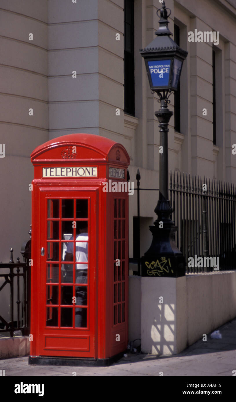 Traditional red British telephone box and police lamp sign London Stock ...