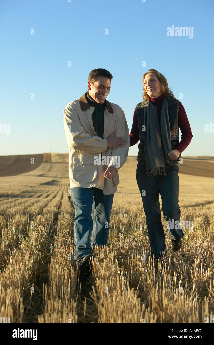Man walking through field touching hi-res stock photography and images ...