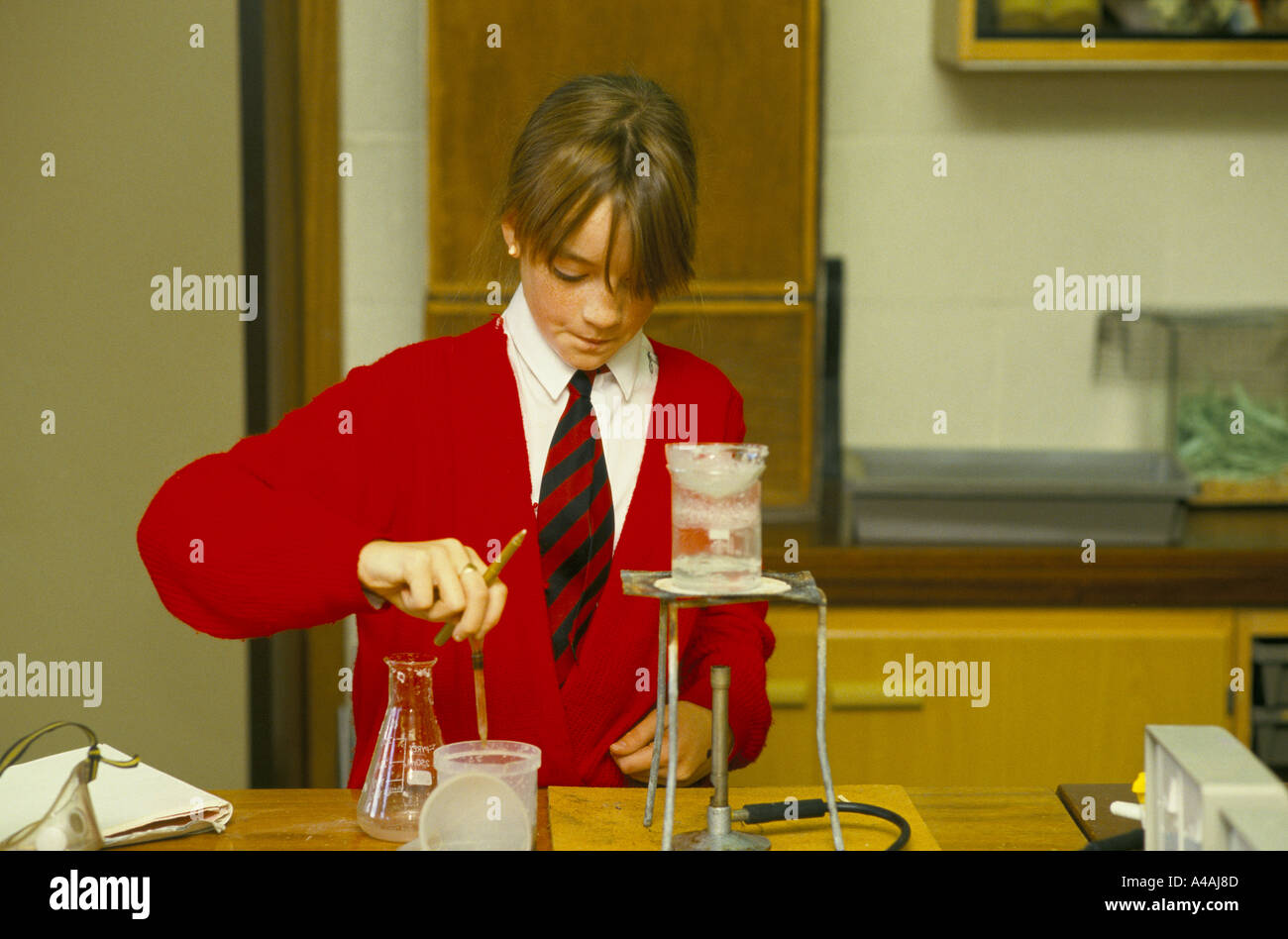 girl doing experiment in science lesson at gloucestershire secondary ...