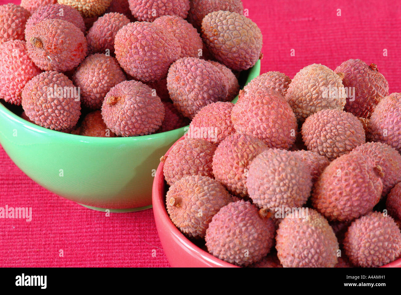 Litchis Leechees Lytchees fruits in the red and green bowls Sapindaceae ...