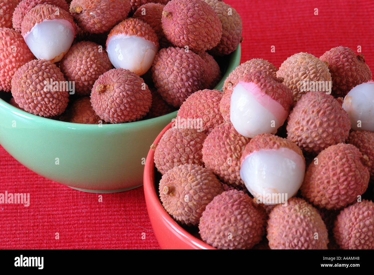 Litchis Leechees Lytchees fruits in the red and green bowls Sapindaceae ...