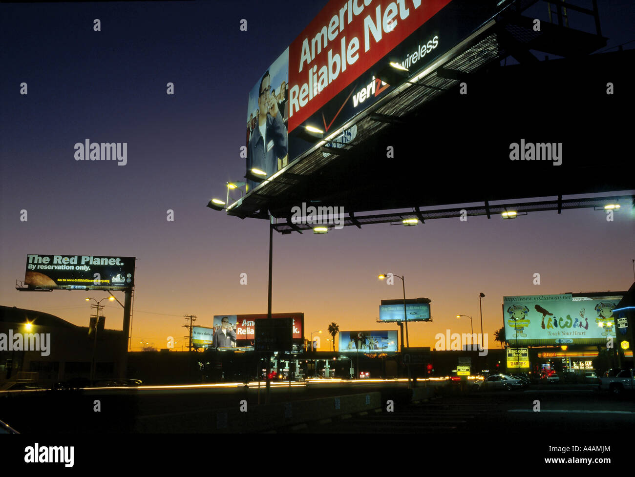Billboards at dusk along Century Boulevard near LAX, Los Angeles ...