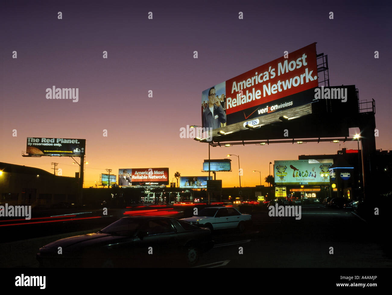 Billboards at dusk along Century Boulevard near LAX, Los Angeles ...