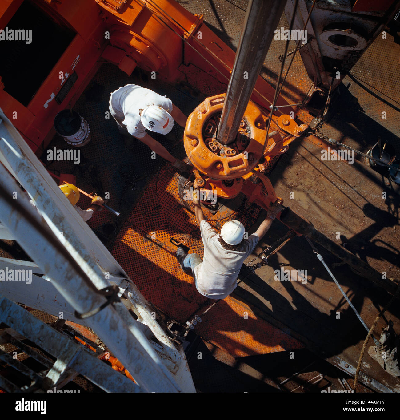 Drilling rig platform with three workers top down angle SW Kansas Stock ...