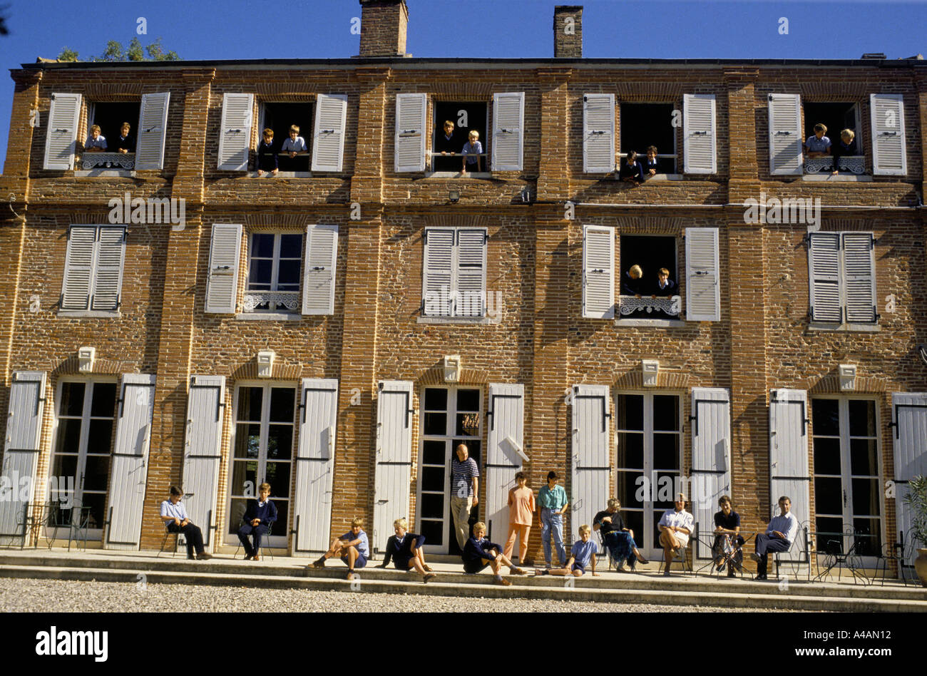 Pupils and teacher standing in front of school building of Cothill ...