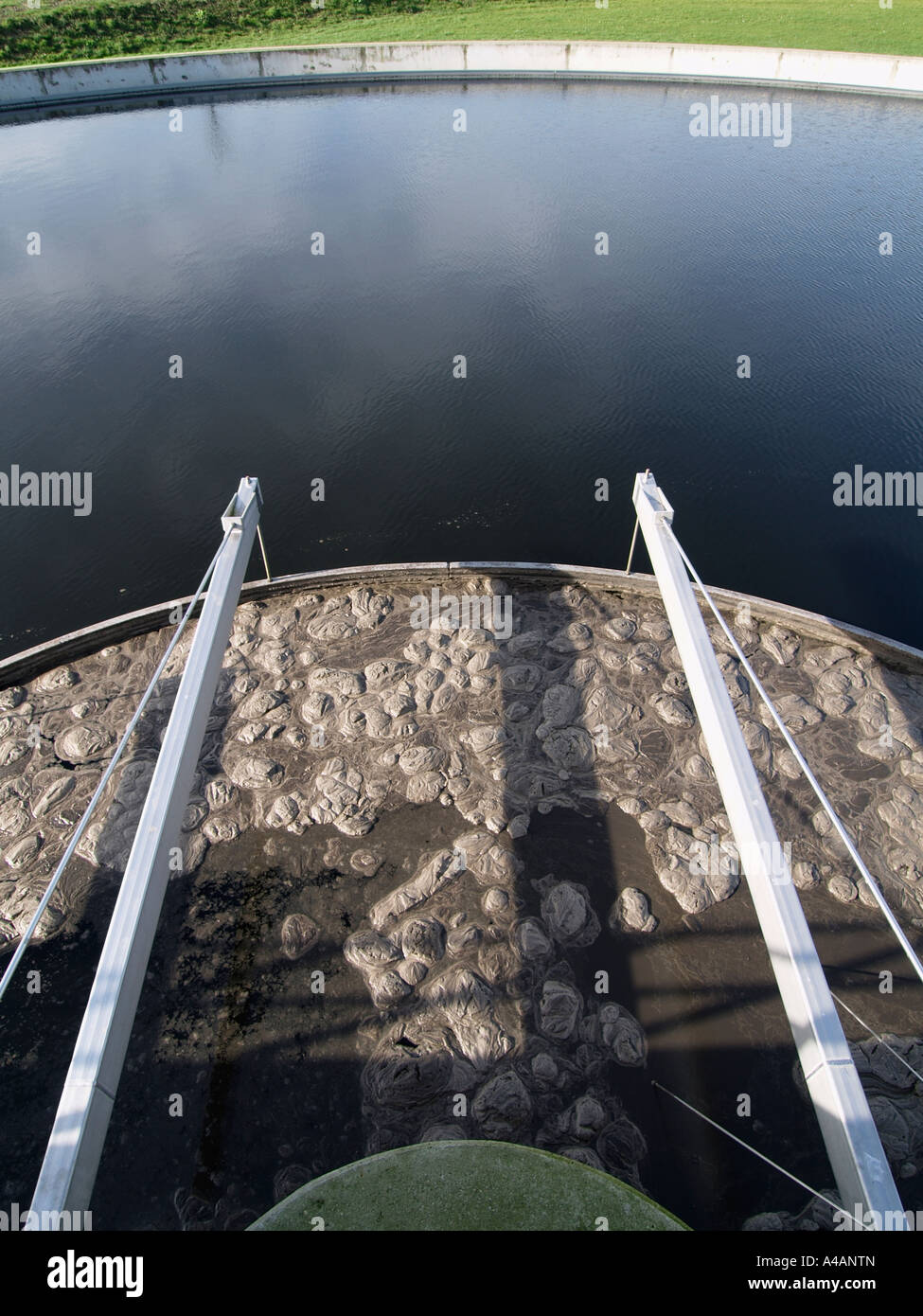 Floating silt ooze mire slime mud being contained and removed in a ...