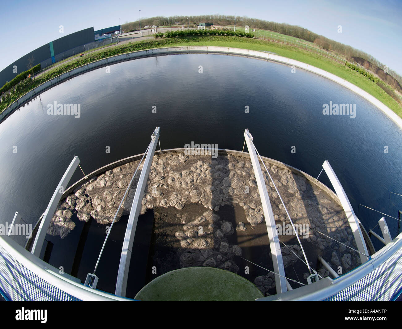 Floating silt ooze mire slime mud being contained and removed in a ...