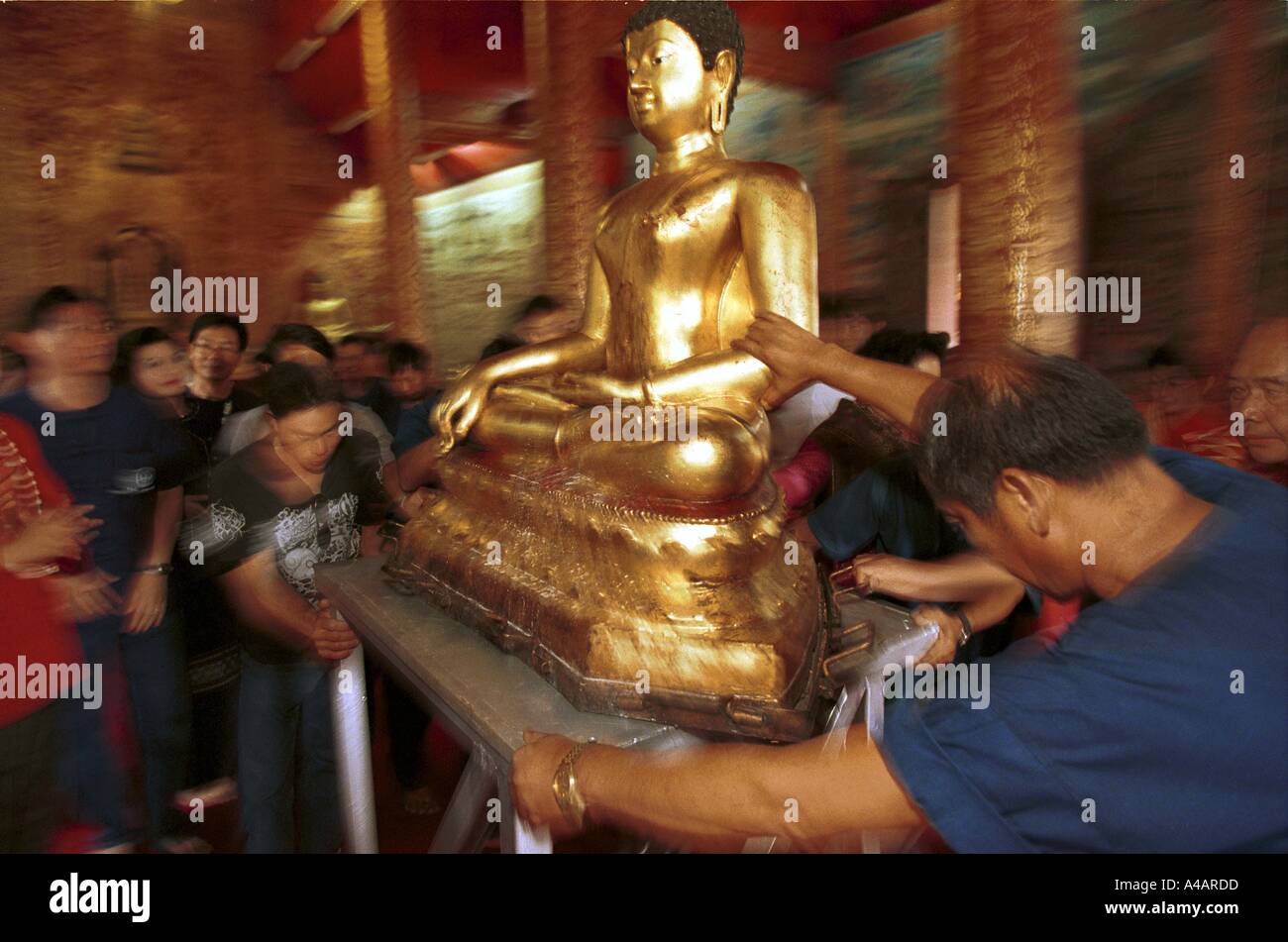 The Prasingh Buddha, a 1600 year old solid gold statue, is brought out ...