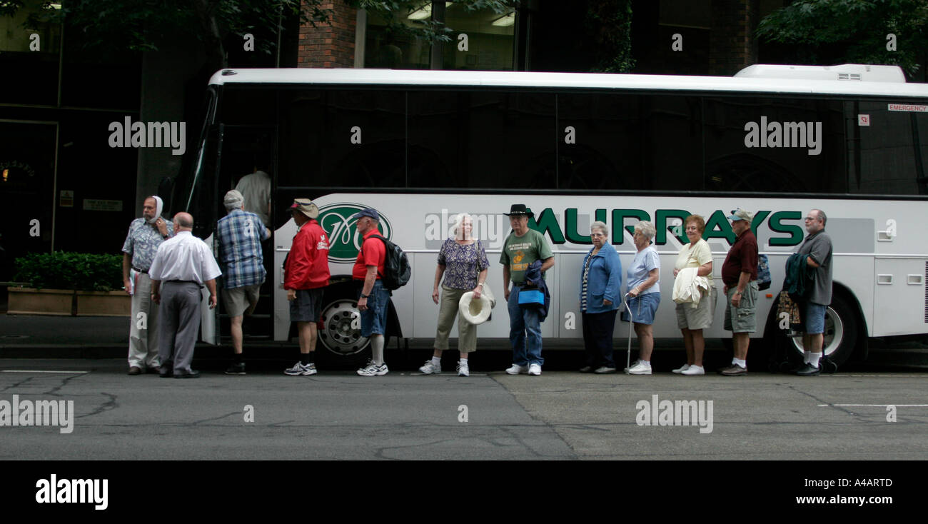 Senior citizens line up to travel by bus Stock Photo - Alamy