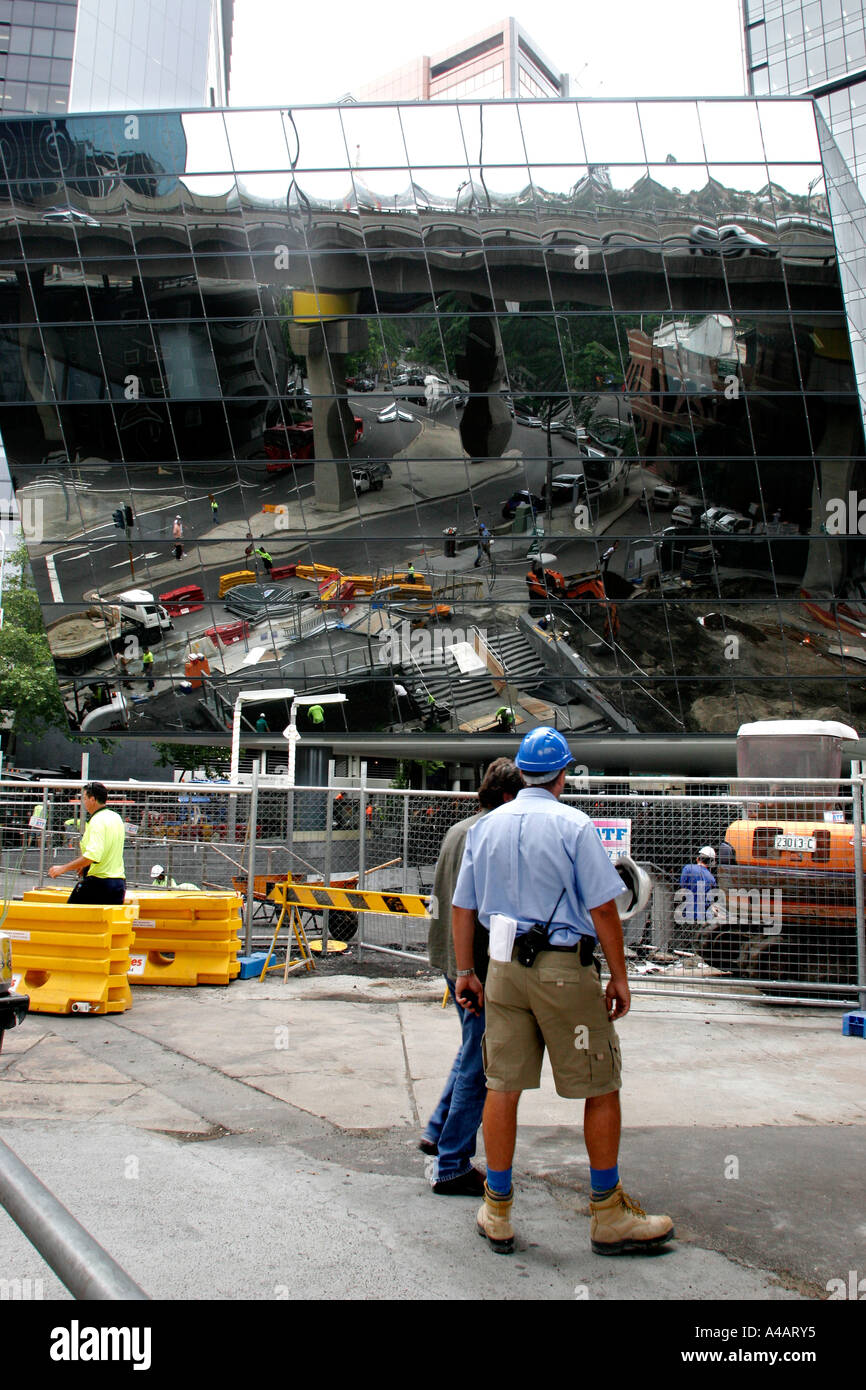 Construction site with men working Stock Photo - Alamy