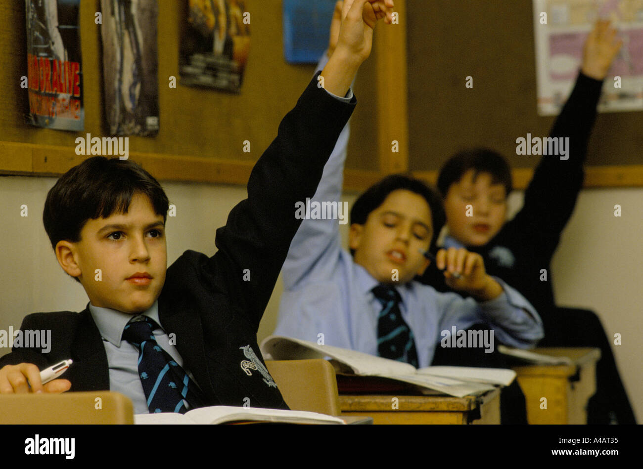 MANCHESTER GRAMMAR SCHOOL CLASSROOM, SCHOOLBOYS RAISING THEIR HANDS TO ...