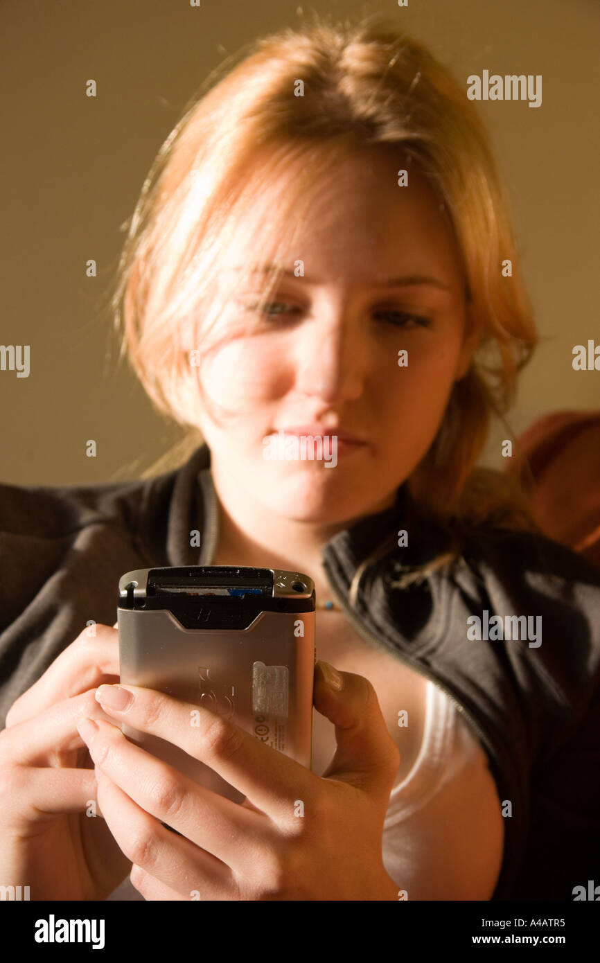 teenage girl on pda Stock Photo - Alamy