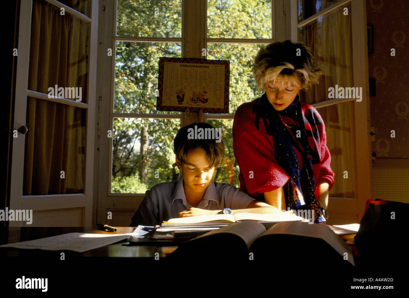 A boy goes through his French work with his teacher.Cothill School is a ...
