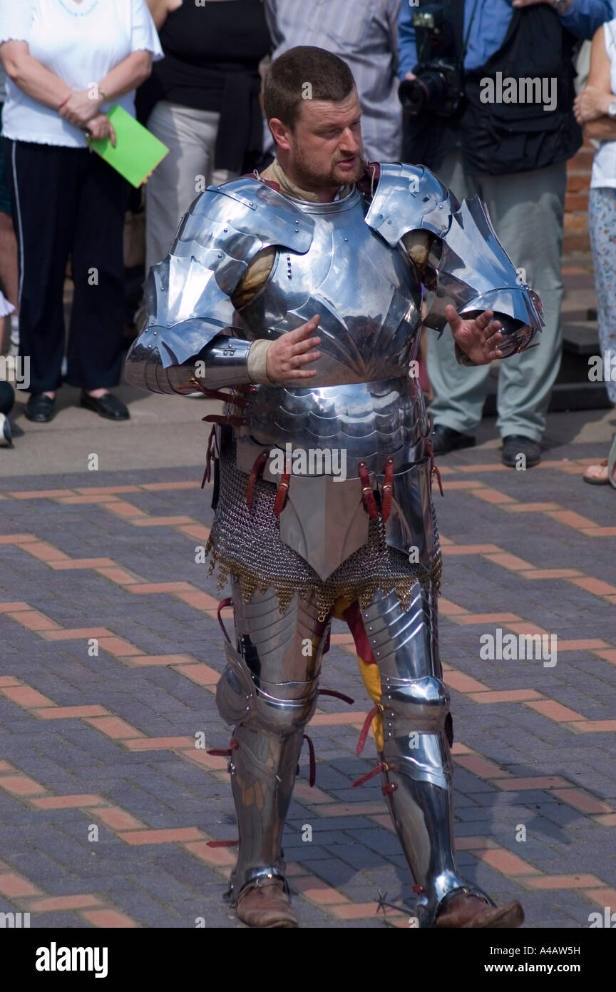 A knight demonstrates to a crowd how he would have prepared for battle ...