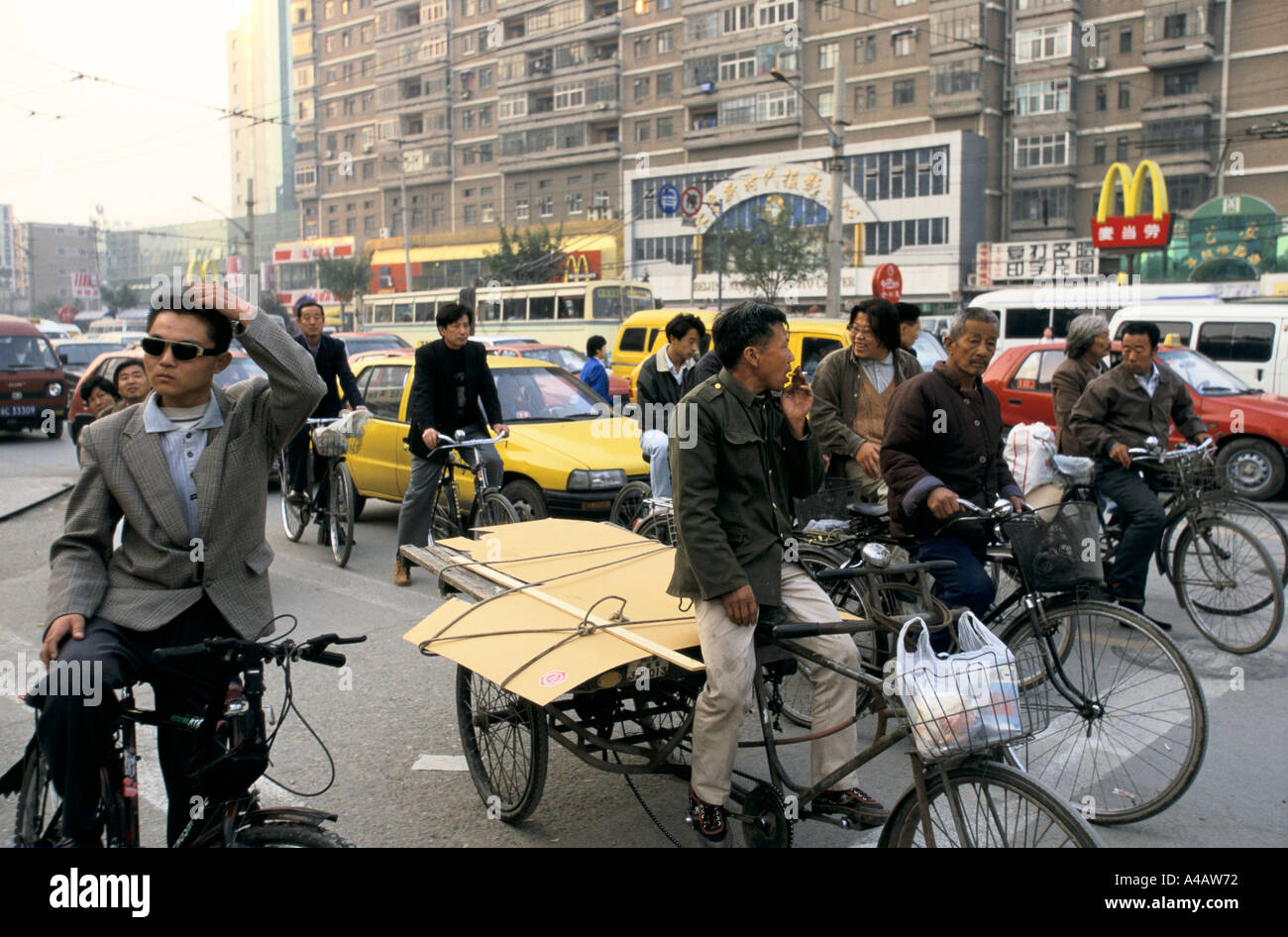 Beijing, China 1997: bicycles, cargo trikes and cars on the busy ...