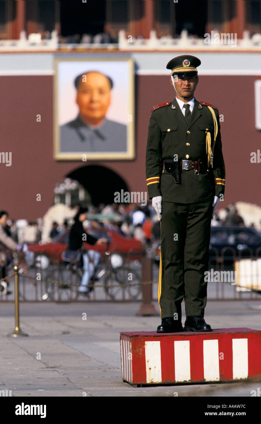 Beijing, China 1997: a guard stands on duty in Tiananmen Square with a ...