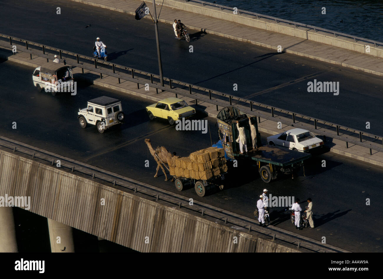 karachi pakistan a motor cyclist is stopped by police on karachi road ...