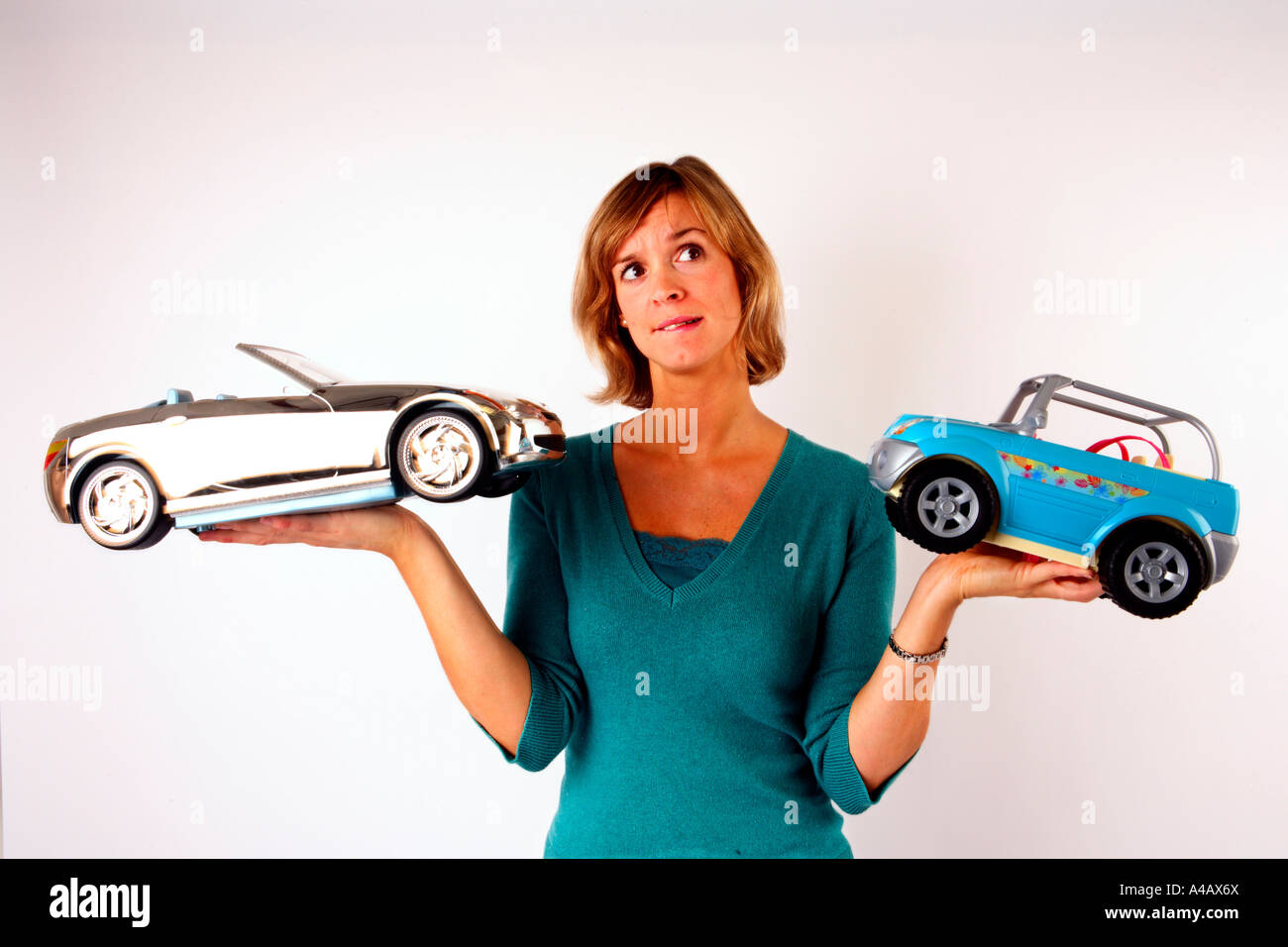 MODEL WOMAN CHOOSING A CAR Stock Photo - Alamy